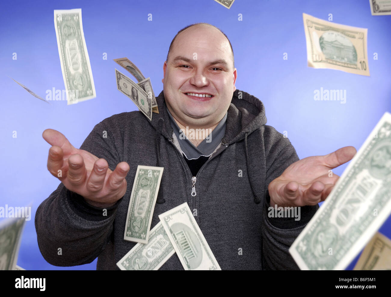 man spending money like water Stock Photo - Alamy