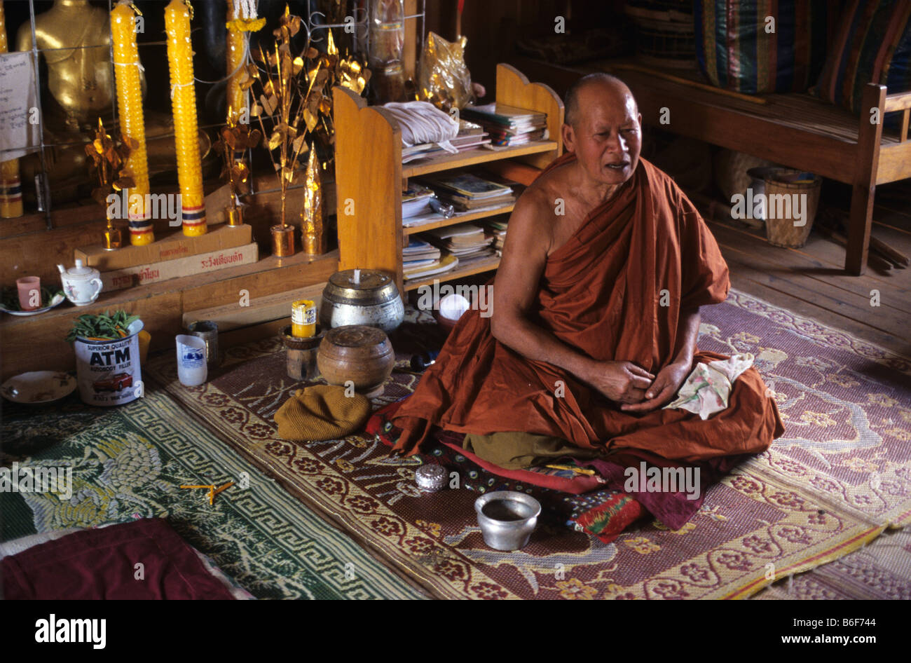 Buddhist Abbot or Monk surrounded by holy texts and religious ...