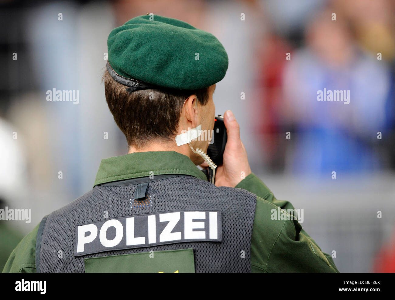 Riot policeman with a radio Stock Photo - Alamy