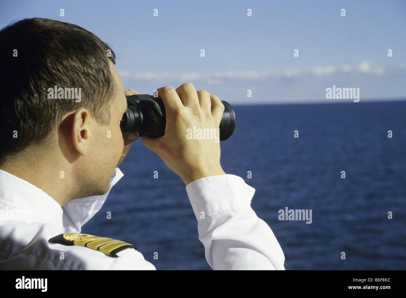 officer looking through binoculars Stock Photo - Alamy