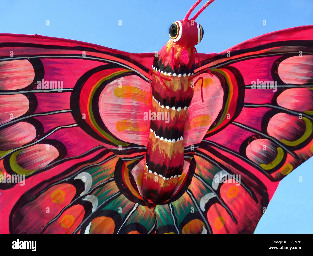 red Balinese traditional kite in the blue sky of Bali, Indonesia, Bali ...