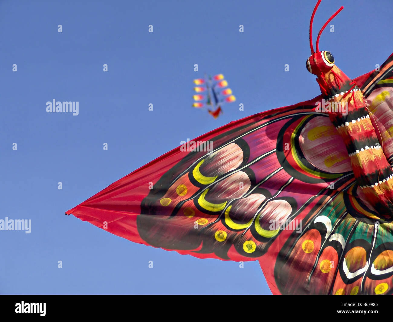 red Balinese traditional kite in the blue sky of Bali, Indonesia, Bali ...