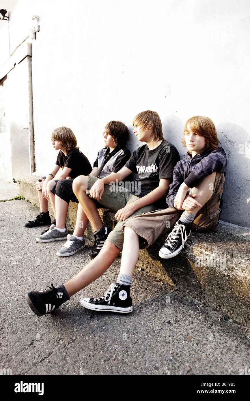 Four boys in a backyard Stock Photo - Alamy