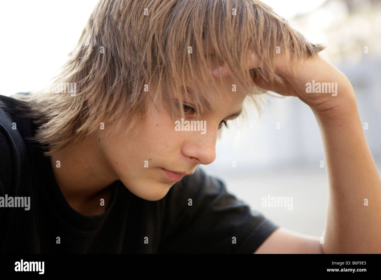 Boy, 14, contemplative Stock Photo - Alamy