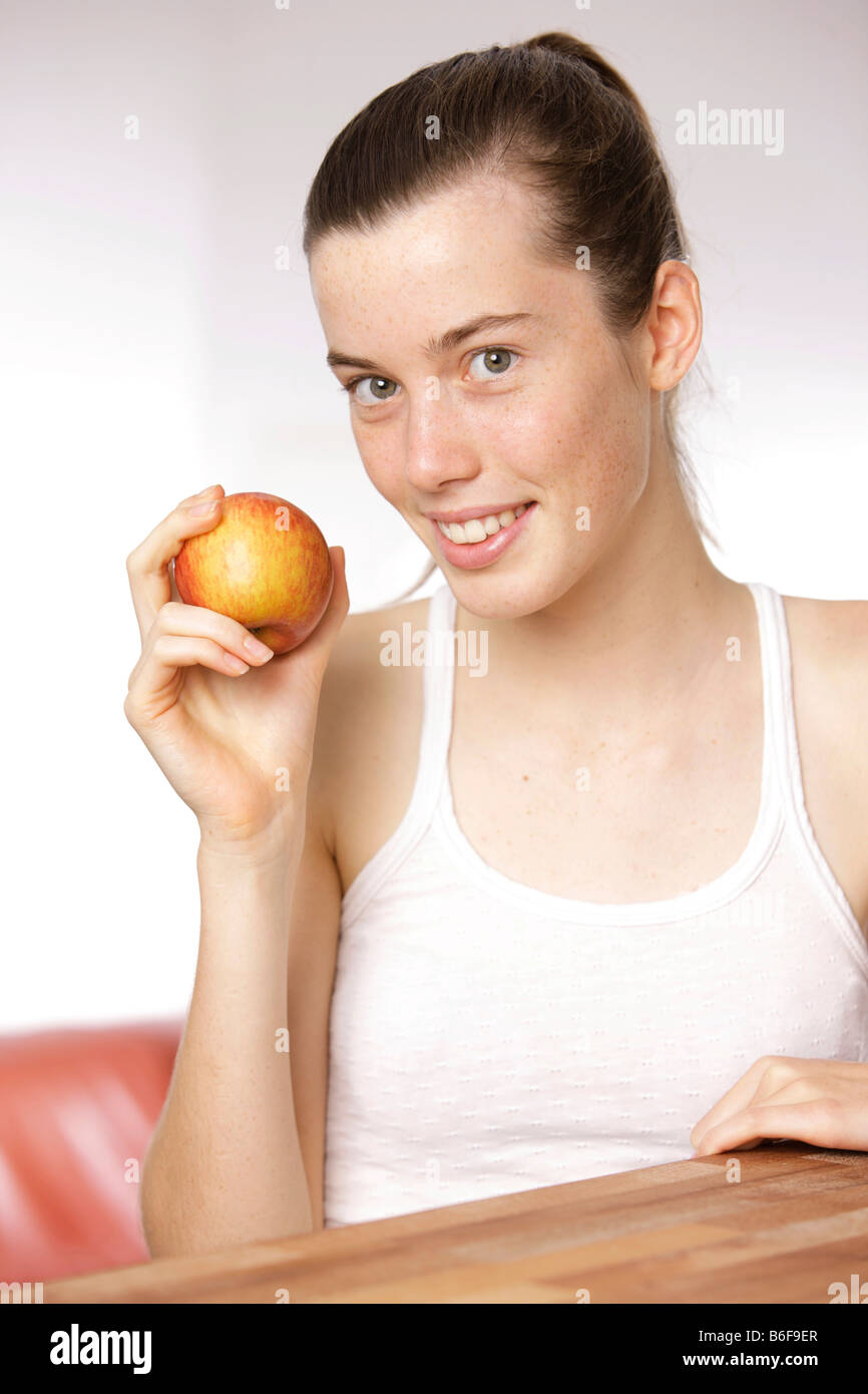 Girl with an apple Stock Photo - Alamy