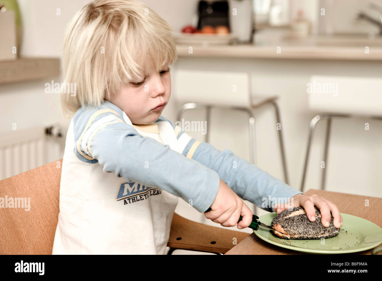 Kid cutting bread hi-res stock photography and images - Alamy