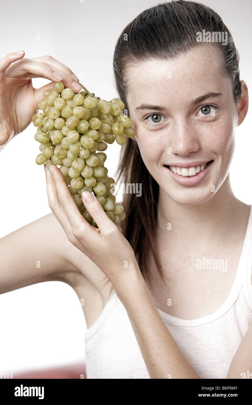 Girl eating a bunch of grapes hi-res stock photography and images - Alamy