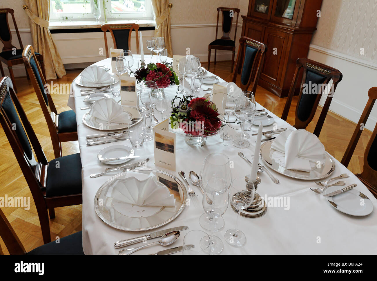 Banquet table set for six people in the Biedermeierzimmer or ...