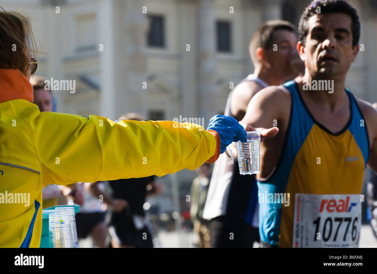 Athlete people handing out water hi-res stock photography and images ...