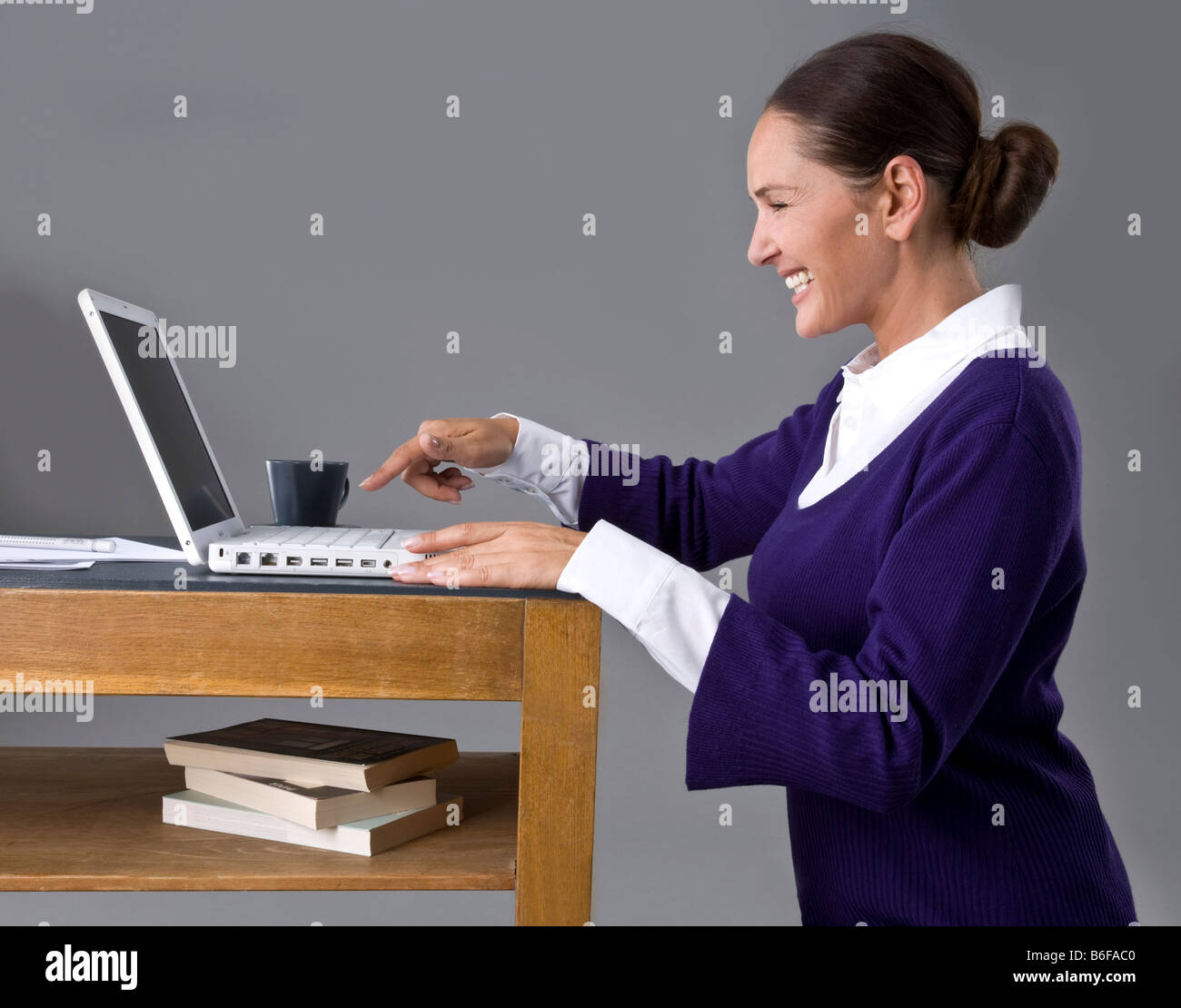 Nice pleasant woman typing hi-res stock photography and images - Alamy