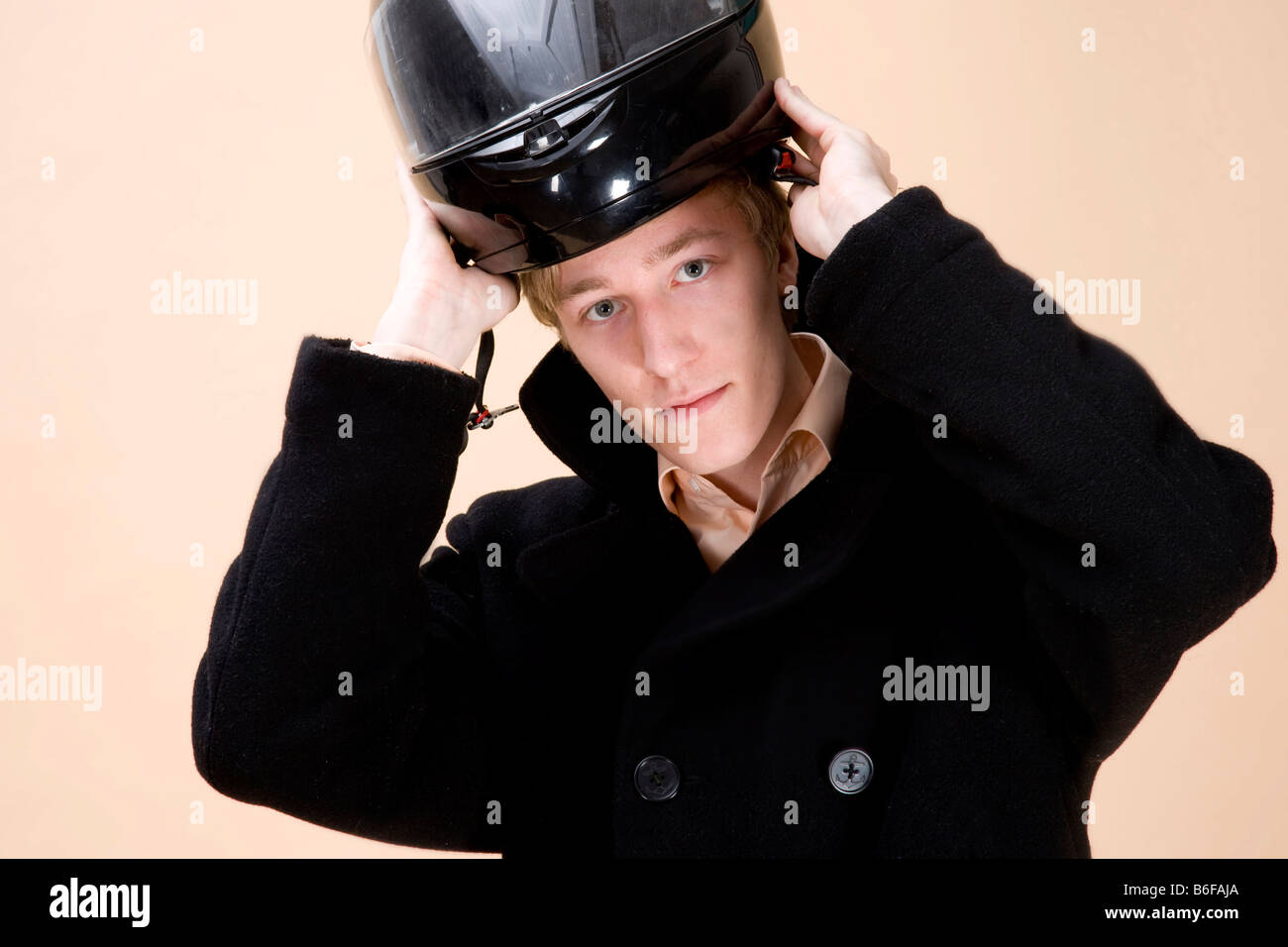 Young man with a helmet Stock Photo - Alamy