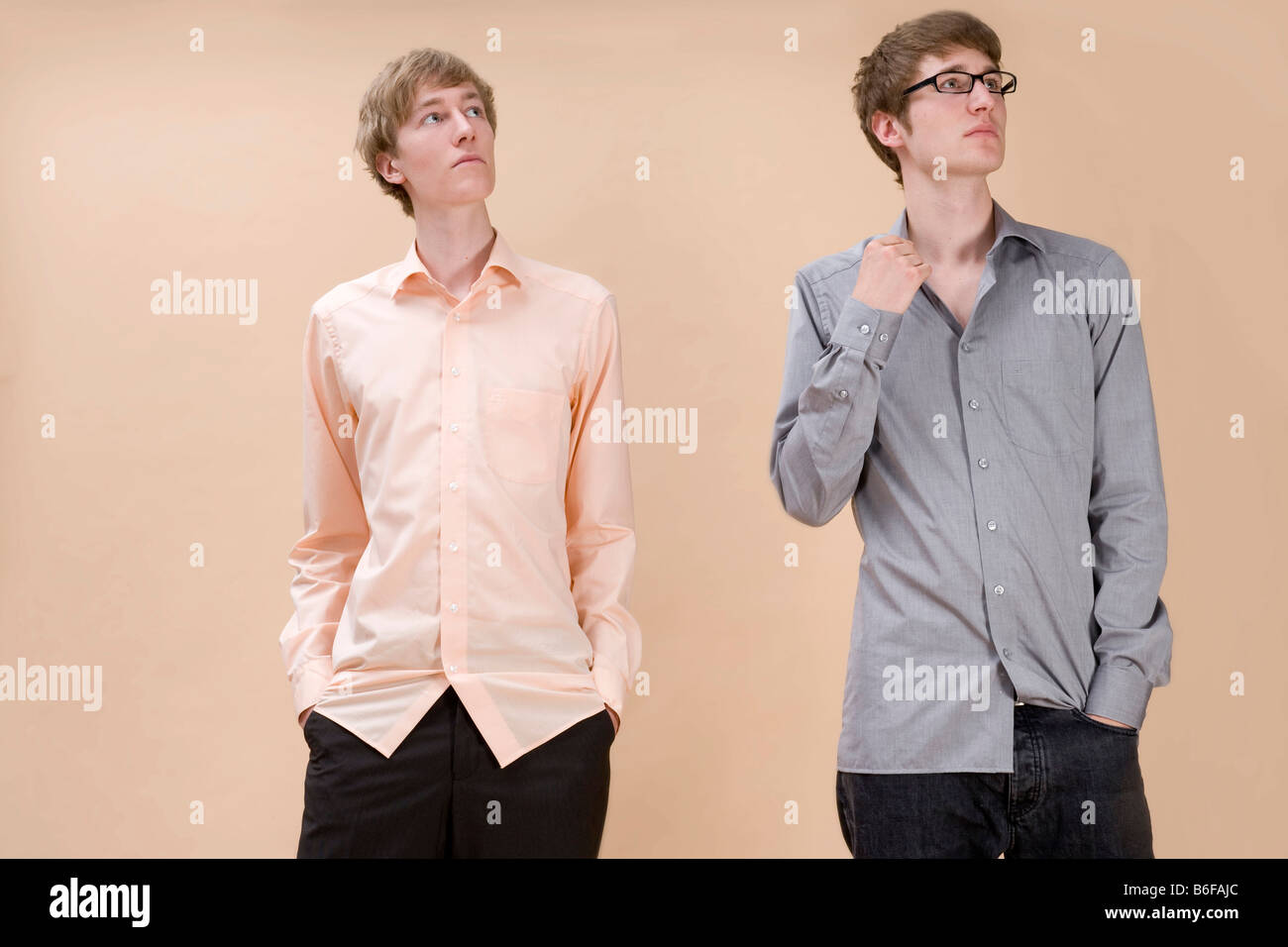 Two boys looking interested in something Stock Photo - Alamy