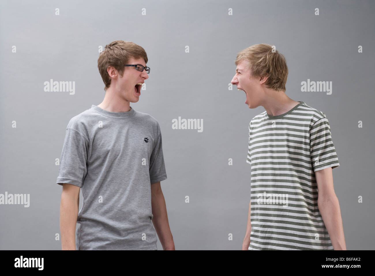Two boys yelling at each other Stock Photo - Alamy