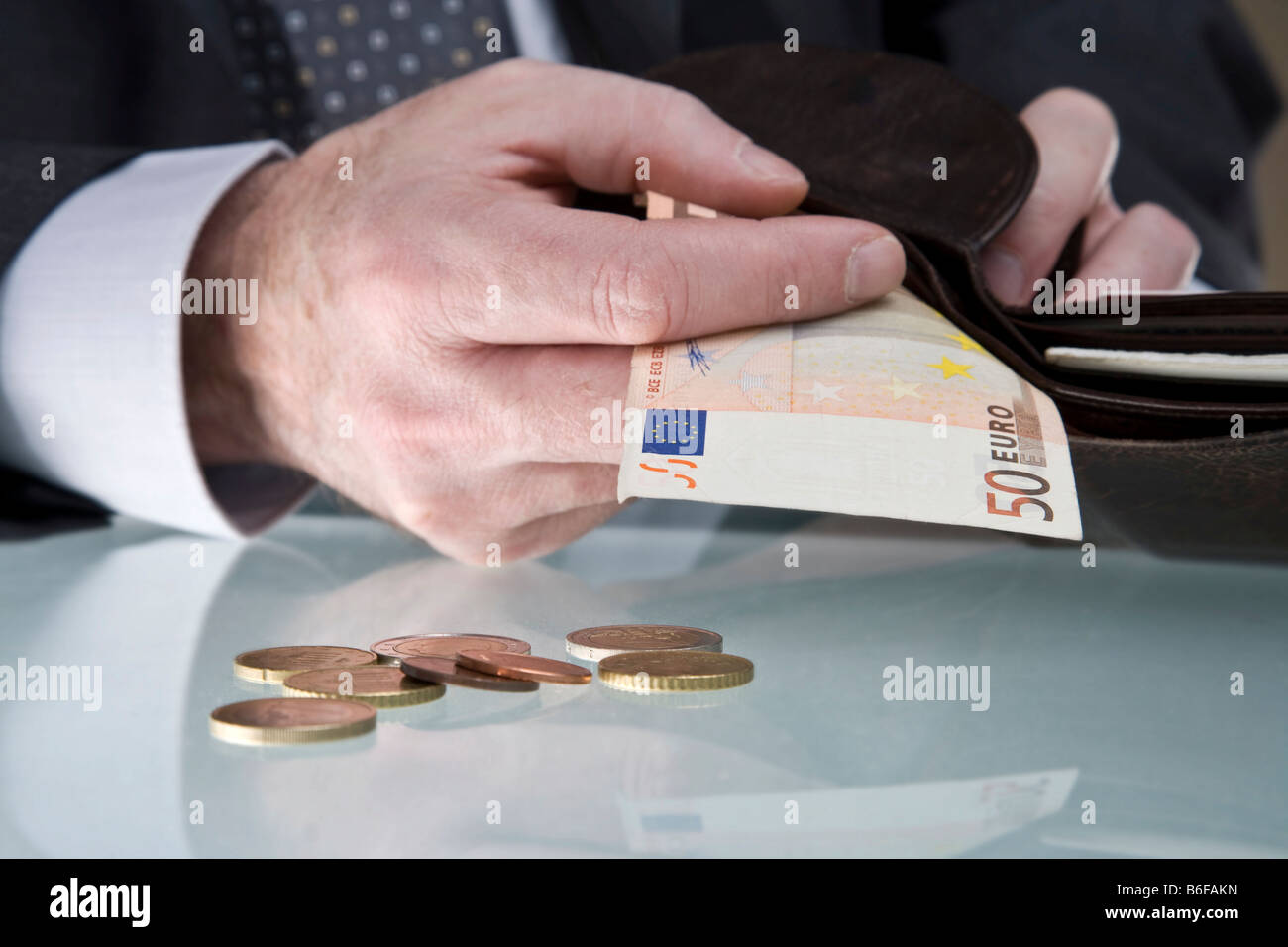 Hands of a businessman counting money Stock Photo - Alamy
