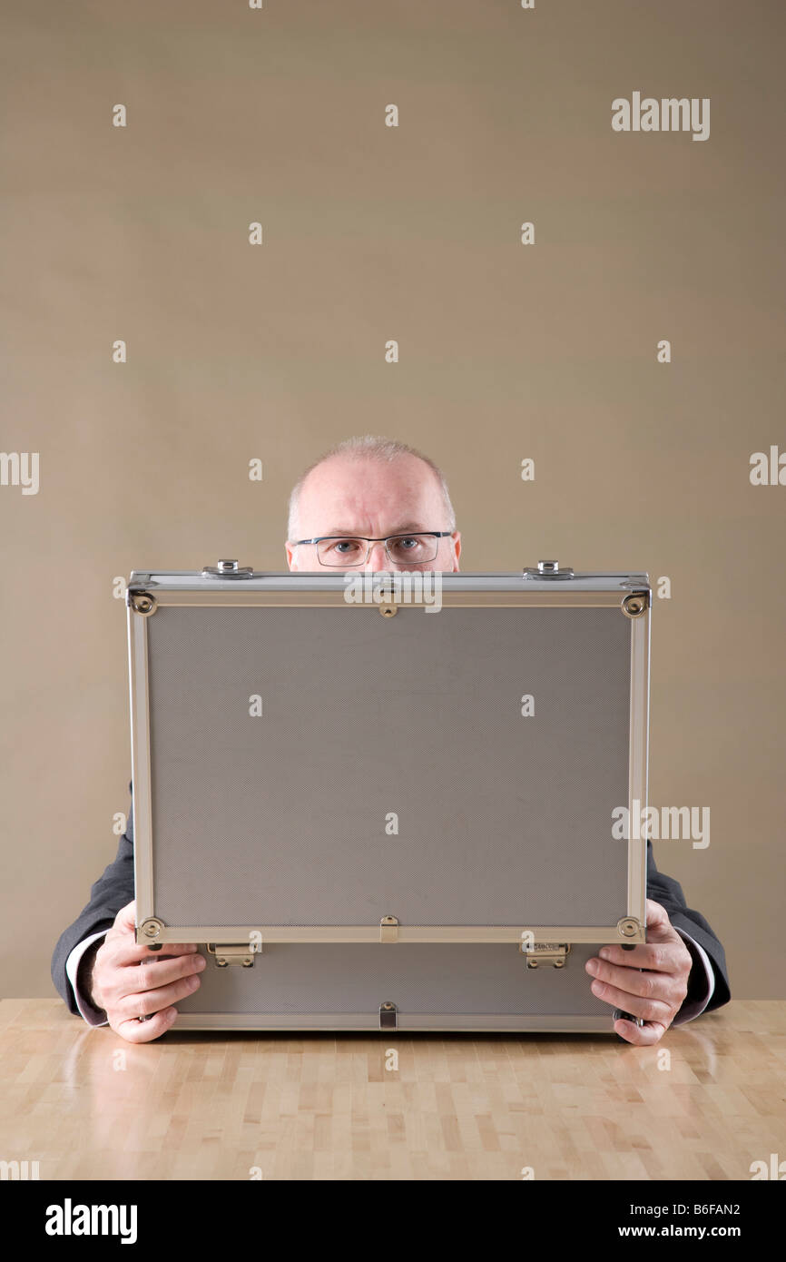 Old man with suitcase full of money hi-res stock photography and images ...