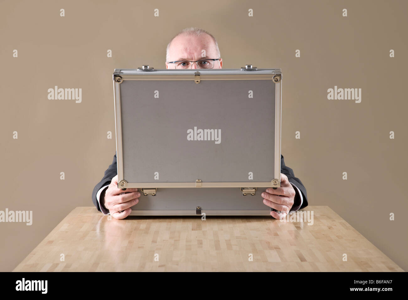 Old man with suitcase full of money hi-res stock photography and images ...