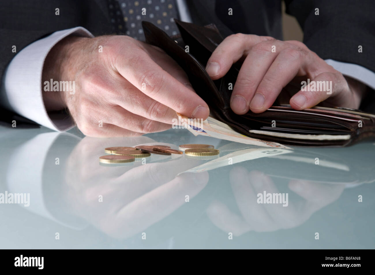 Hands of a businessman counting money Stock Photo - Alamy