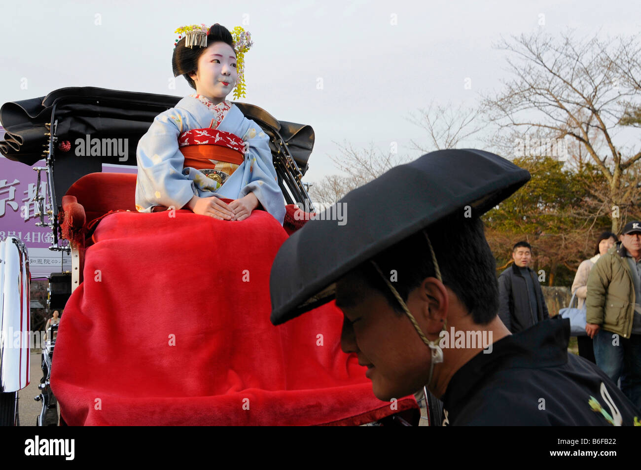 A Maiko, a trainee Geisha, sitting in a rickshaw, Kyoto, Japan, Asia ...