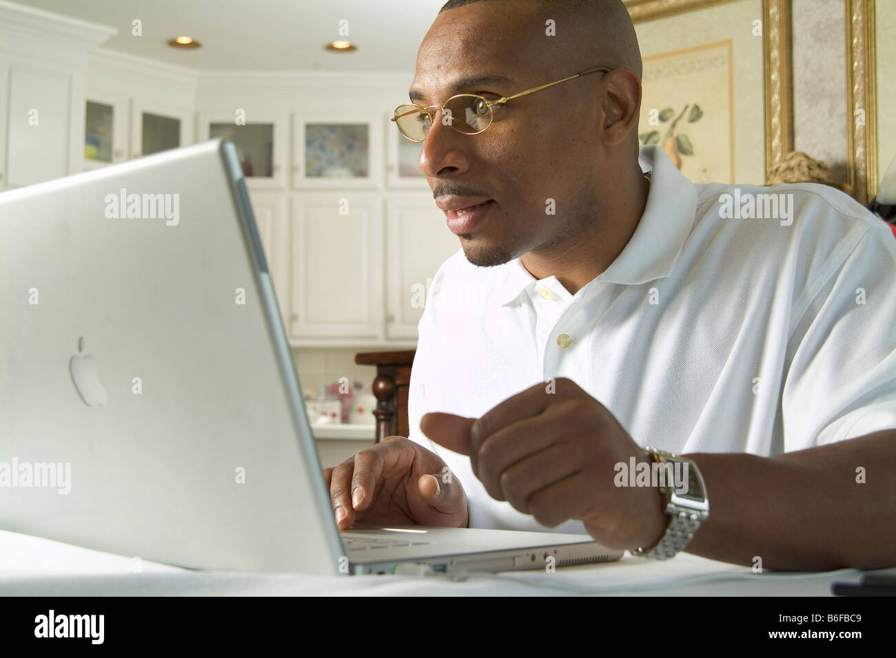 man working with his laptop at home Stock Photo - Alamy
