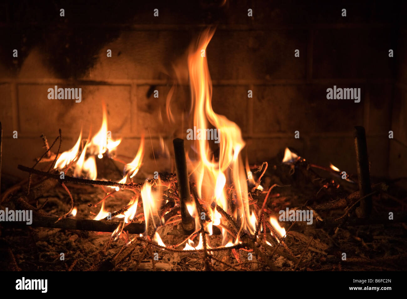 Fire burning in brick fireplace hi-res stock photography and images - Alamy