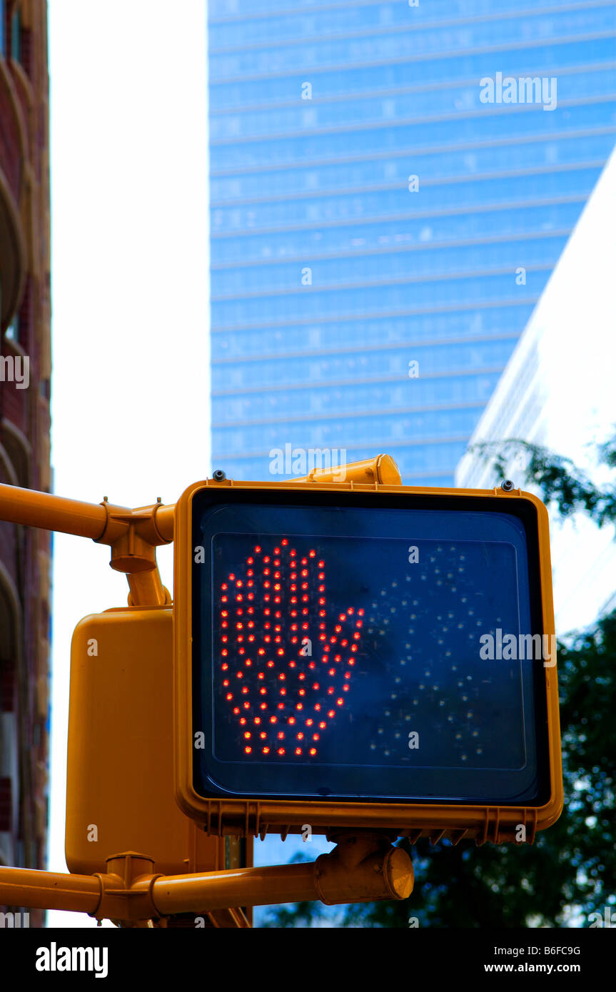 Pedestrian traffic light on STOP, in front of skyscrapers, New York ...