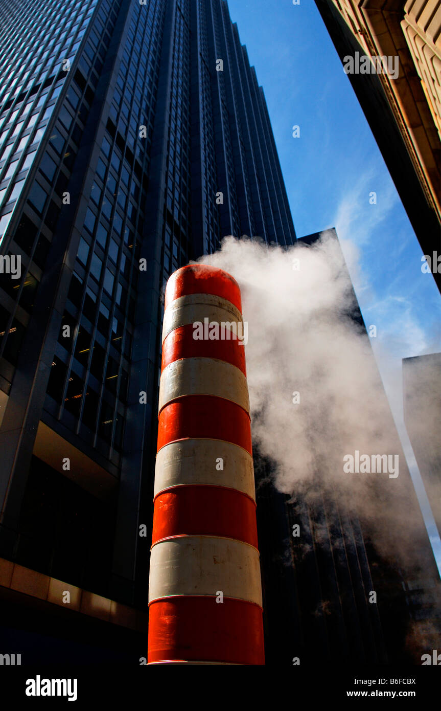 Steaming smoke stack at a construction site, skyscrapers at back, New ...