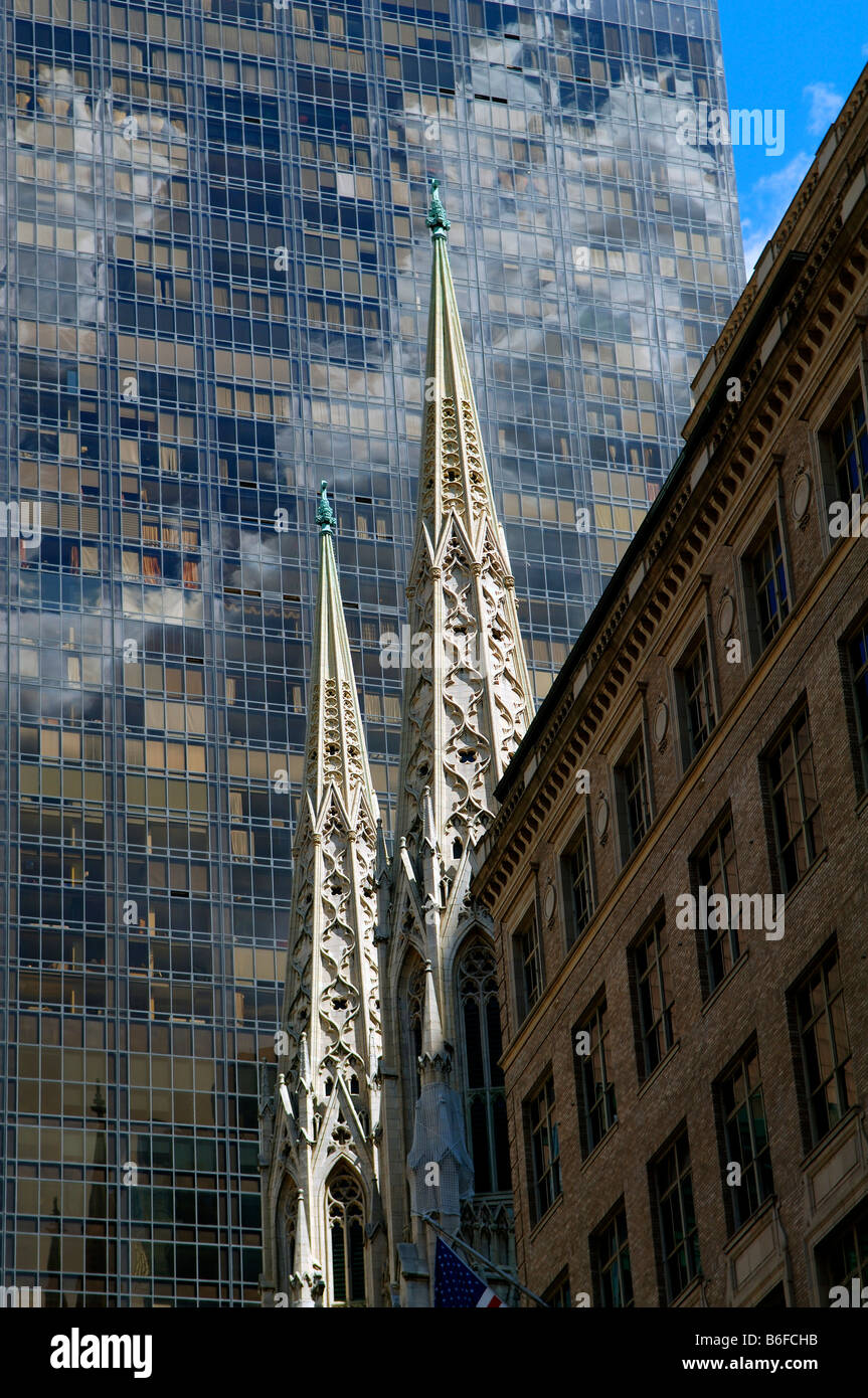 St. Patrick's Cathedral steeples in front of skyscraper, New York City ...