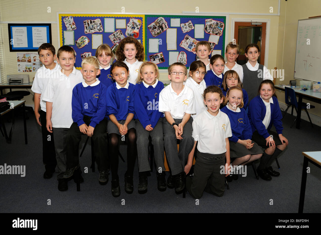 Group of primary school children in a classroom Stock Photo - Alamy