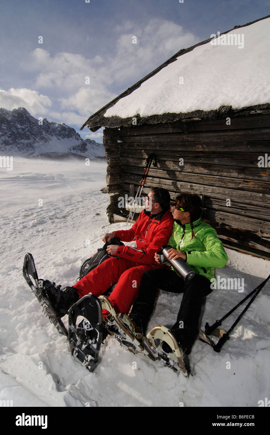 Snowshoe hikers on the Alpe Nemes Alps in the High Puster Valley or ...