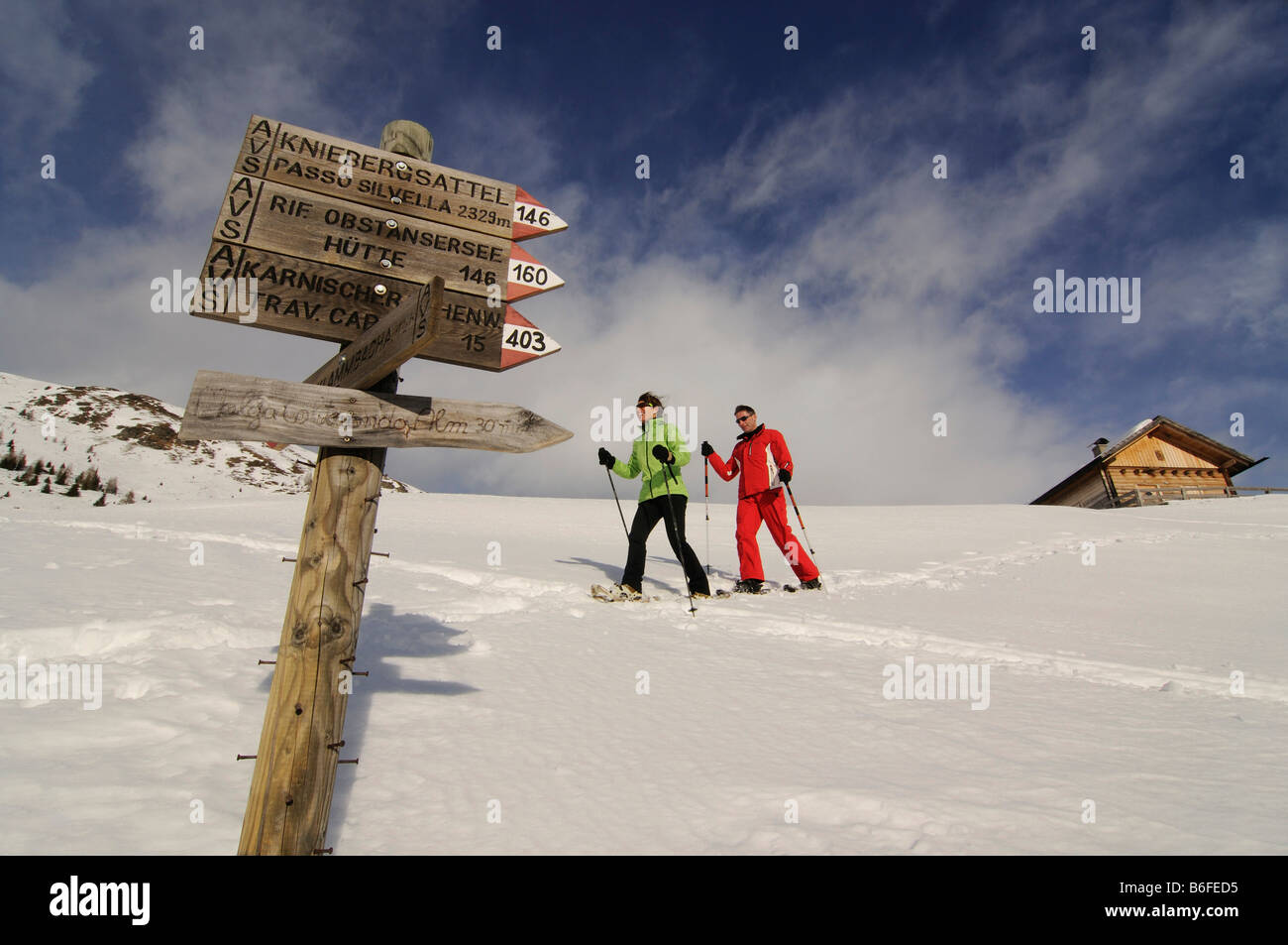 Snowshoe hikers on the Alpe Nemes Alps, in the High Puster Valley or ...