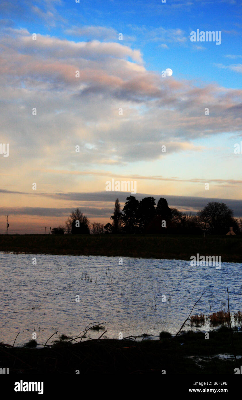A full moon rises above Welney Washes in Cambridgeshire Stock Photo - Alamy