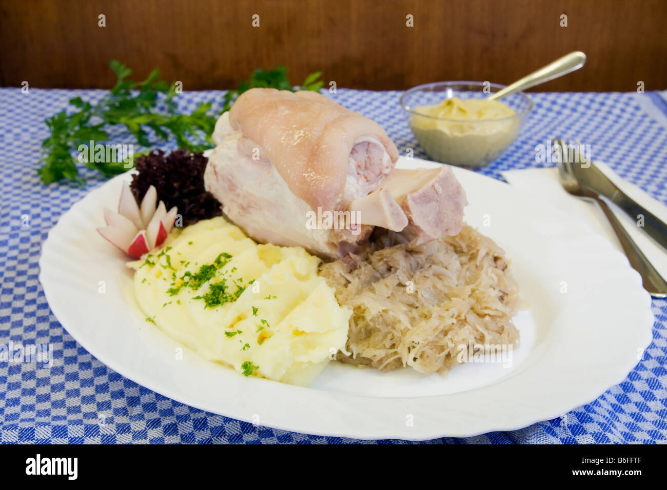 Eisbein, pickled knuckle of pork on sauerkraut and mashed potatoes ...