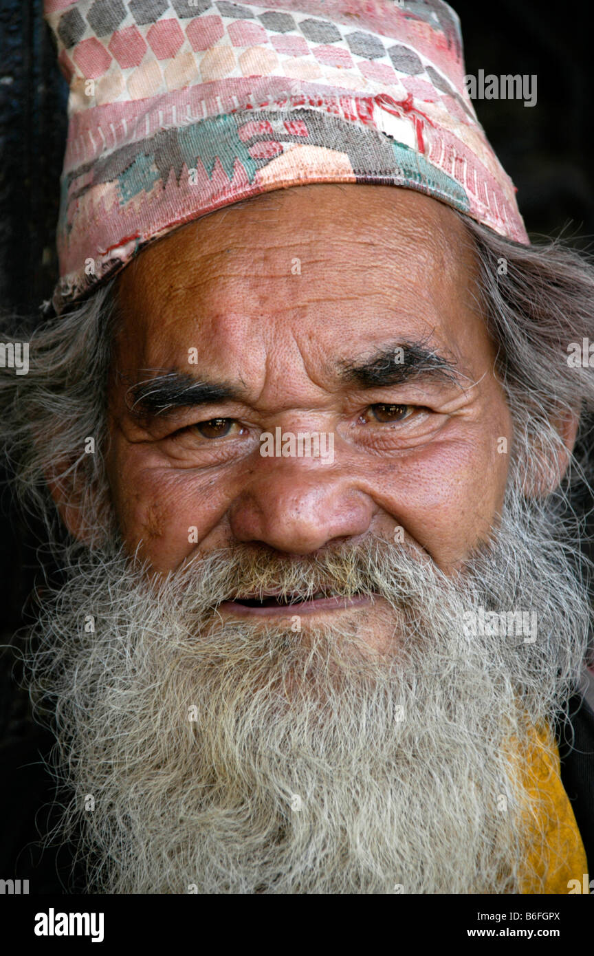 Portrait, Nepalese man wearing a typical hat and a full beard ...