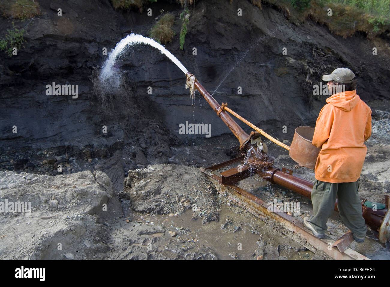 Man washing, thawing permafrost, soil, gold mining, Klondike gold rush ...