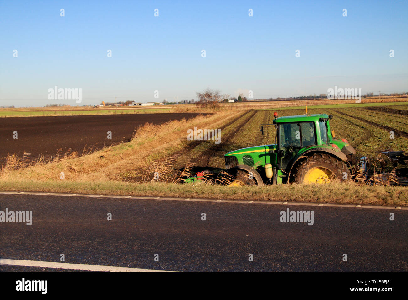 A John Deere tractor in a fenland field Stock Photo - Alamy