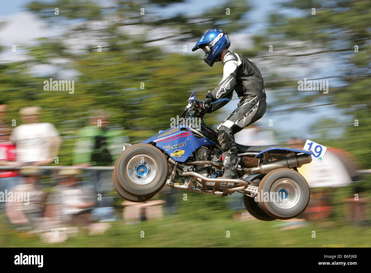 All-terrain vehicle or Quad jumping at a Supermoto race Stock Photo - Alamy