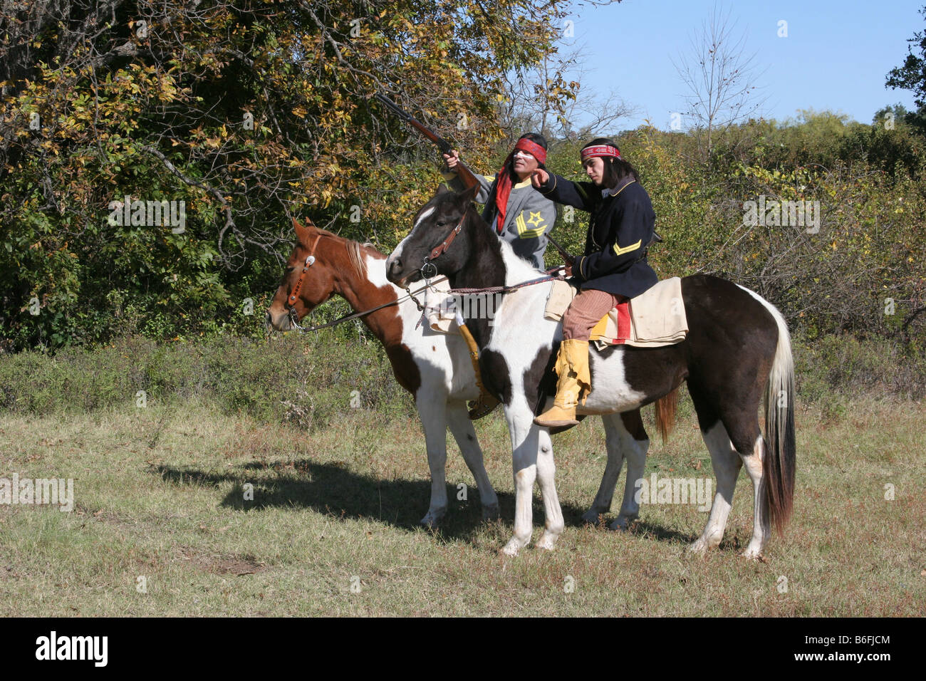 Two Apache Native American Indians on horseback in the bush Stock Photo ...