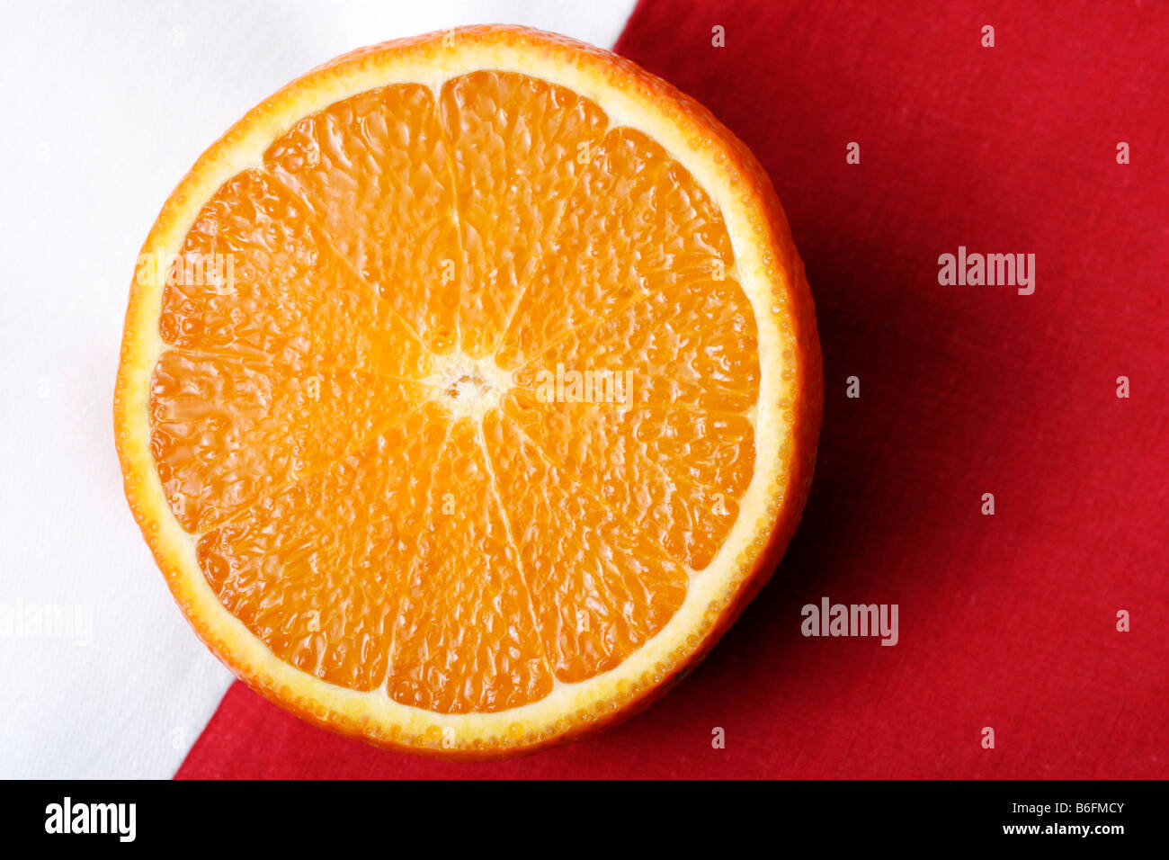 Orange cut in half with orange hi-res stock photography and images - Alamy