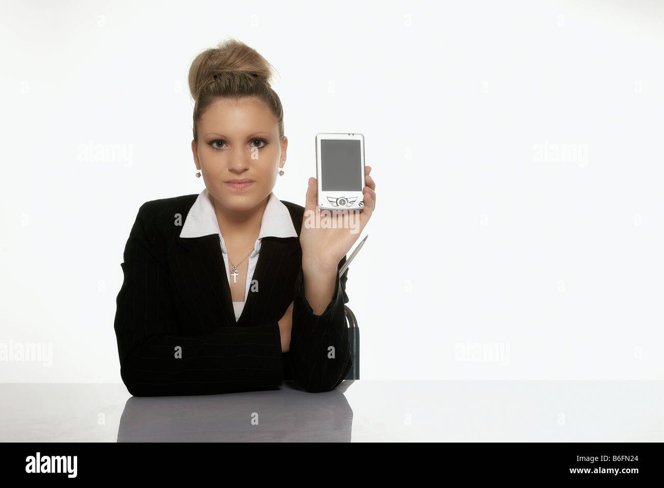 Businesswoman holding her PDA up to the camera Stock Photo - Alamy