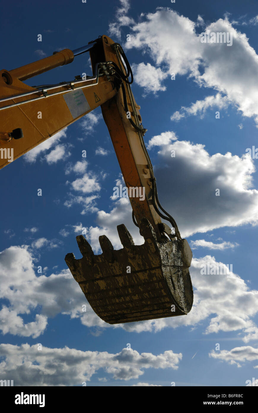 Backhoe arm stretching into the sky, Baden-Wuerttemberg, Germany Stock ...