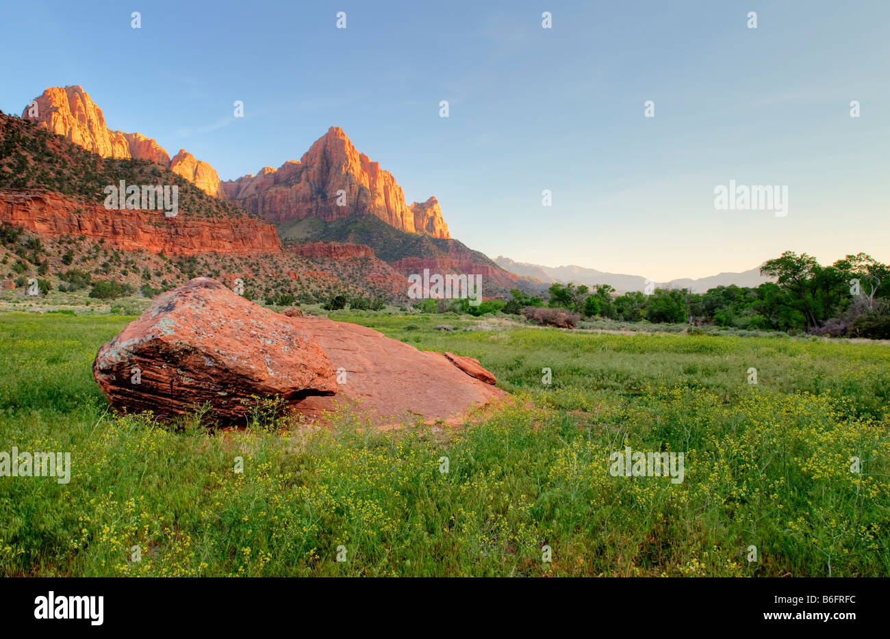The sun sets on the Watchman, a rock formation at Zion National Park ...