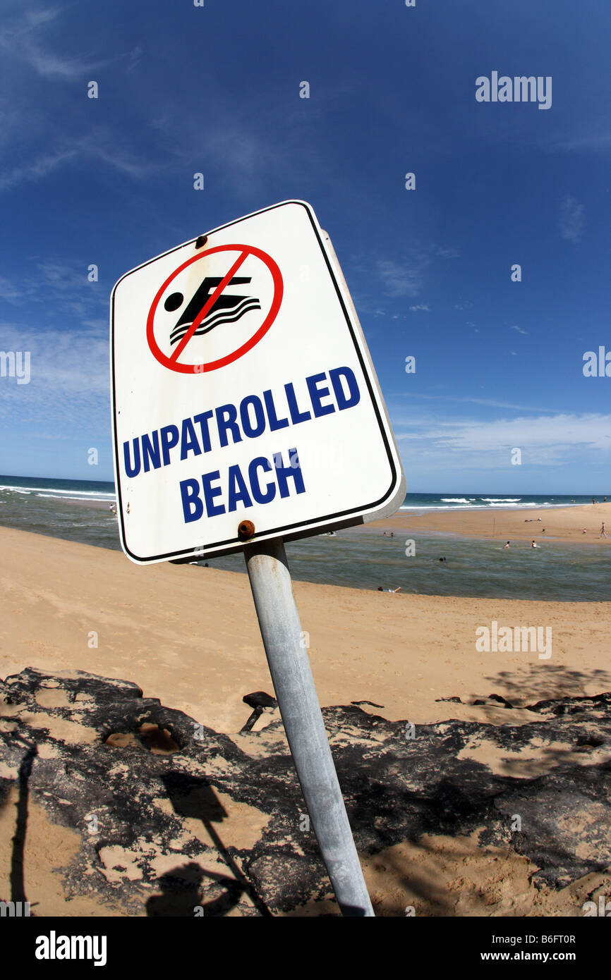 UNPATROLLED BEACH WARNING SIGN BLUE SKY BACKGROUND VERTICAL BDB11206 ...