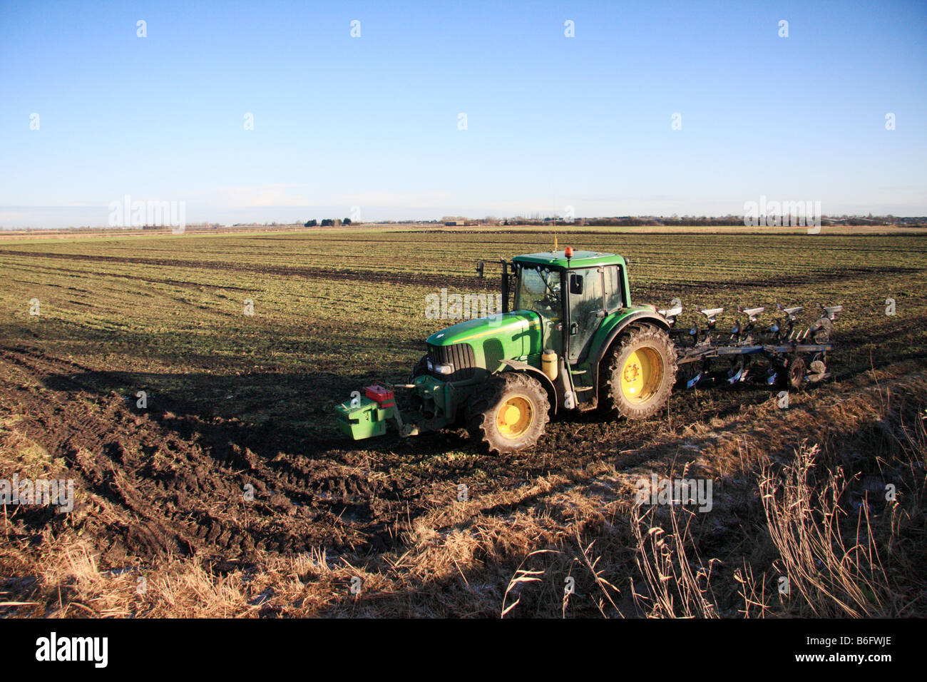 A John Deere tractor in a fenland field Stock Photo - Alamy