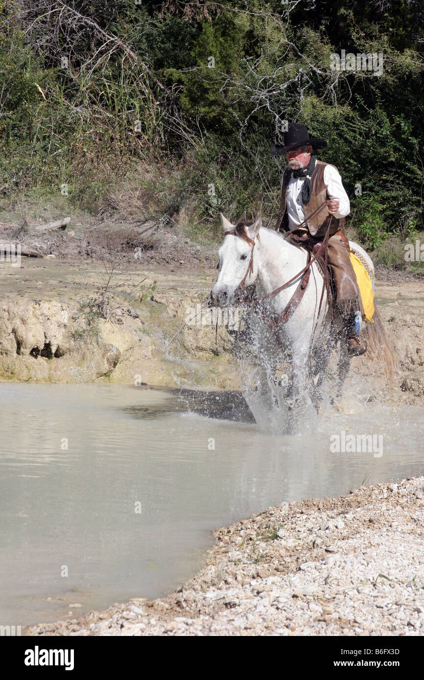 Man riding horse through water hi-res stock photography and images - Alamy