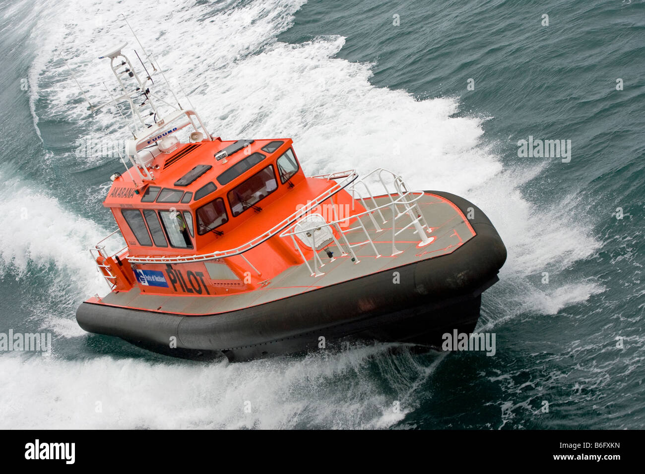 Pilot Boat coming alonside Stock Photo - Alamy