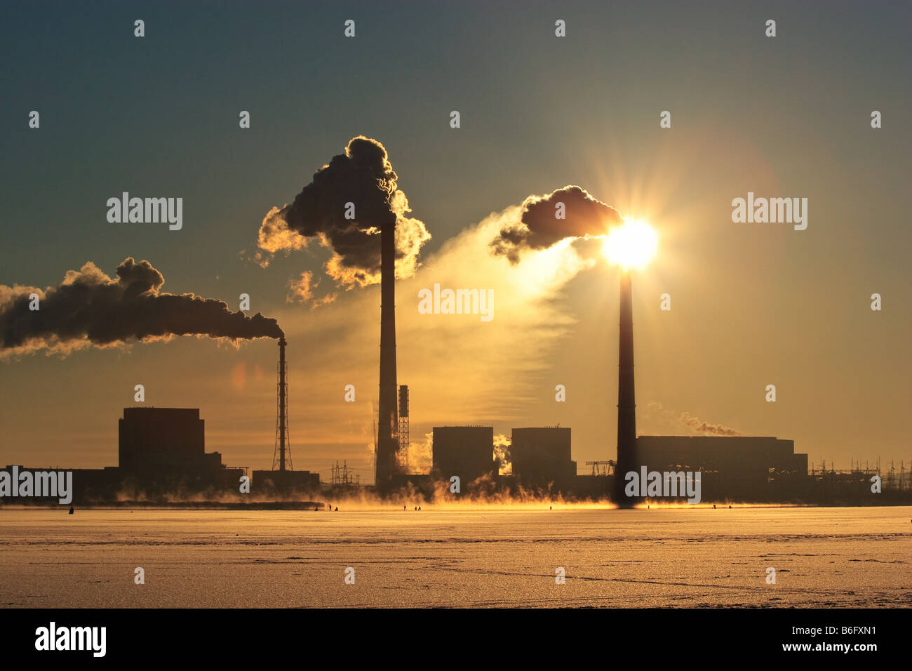 The smoke goes from pipes in a view of the sun Stock Photo - Alamy