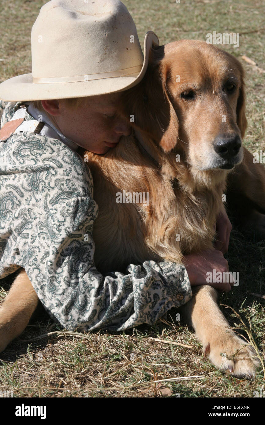 Cute farm dog boy hug hi-res stock photography and images - Alamy