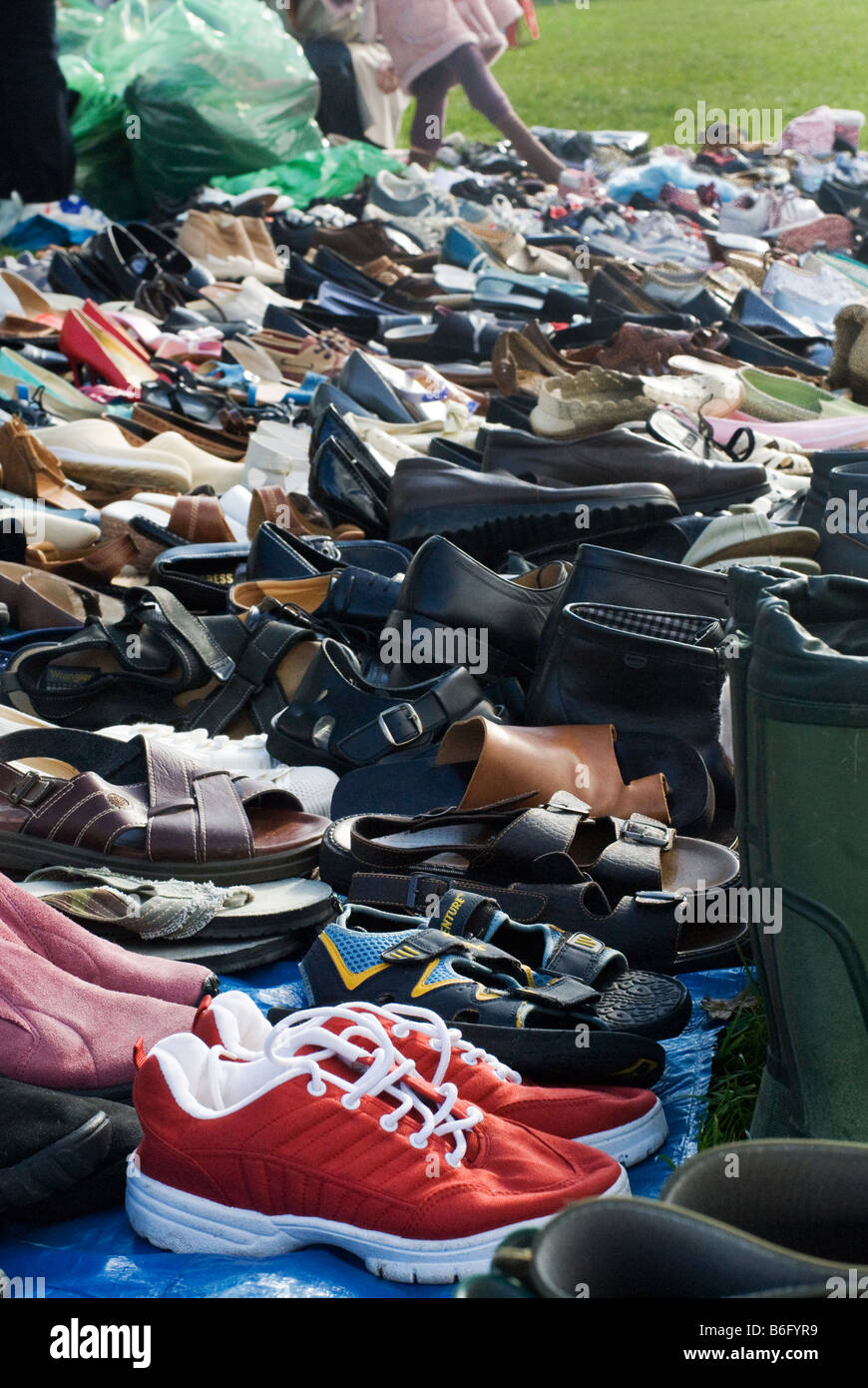 Collection of shoes at a car boot in Tenbury Wells park, Worcestershire ...