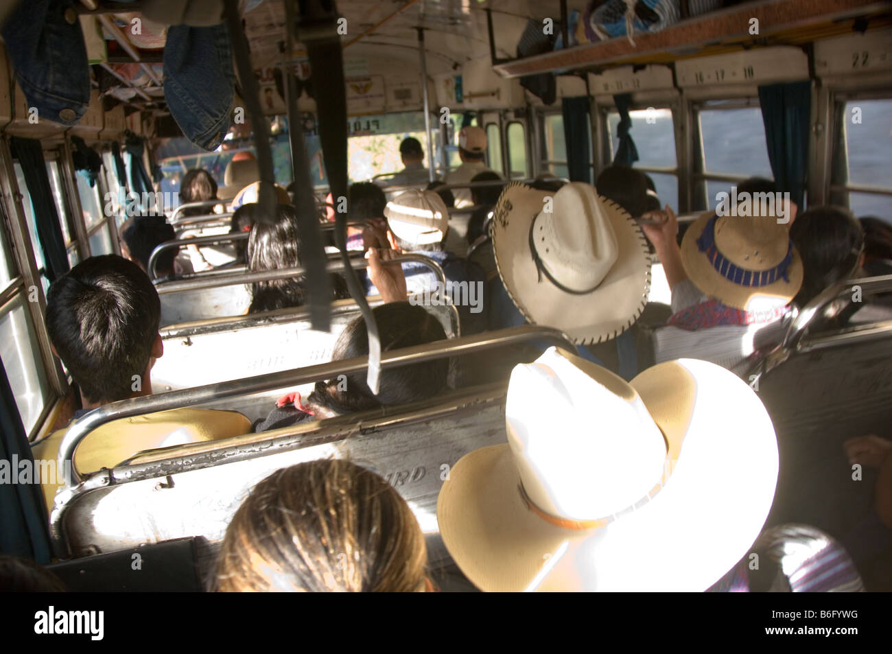 Passengers in a chicken bus in Guatemala, seen from the rear Stock ...