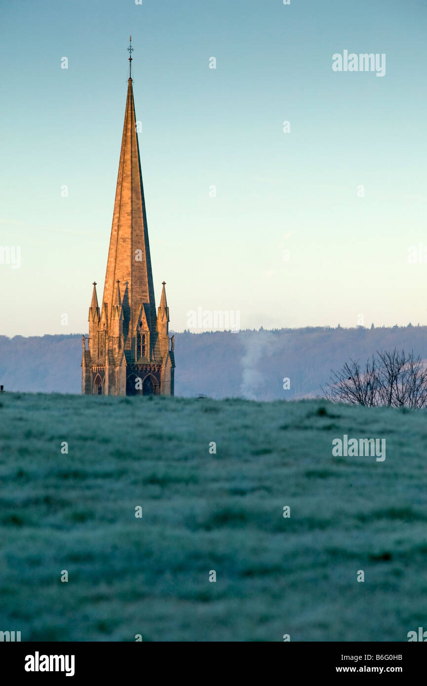 Spire of St Martins Church Dorking rising above frosty grass on ...